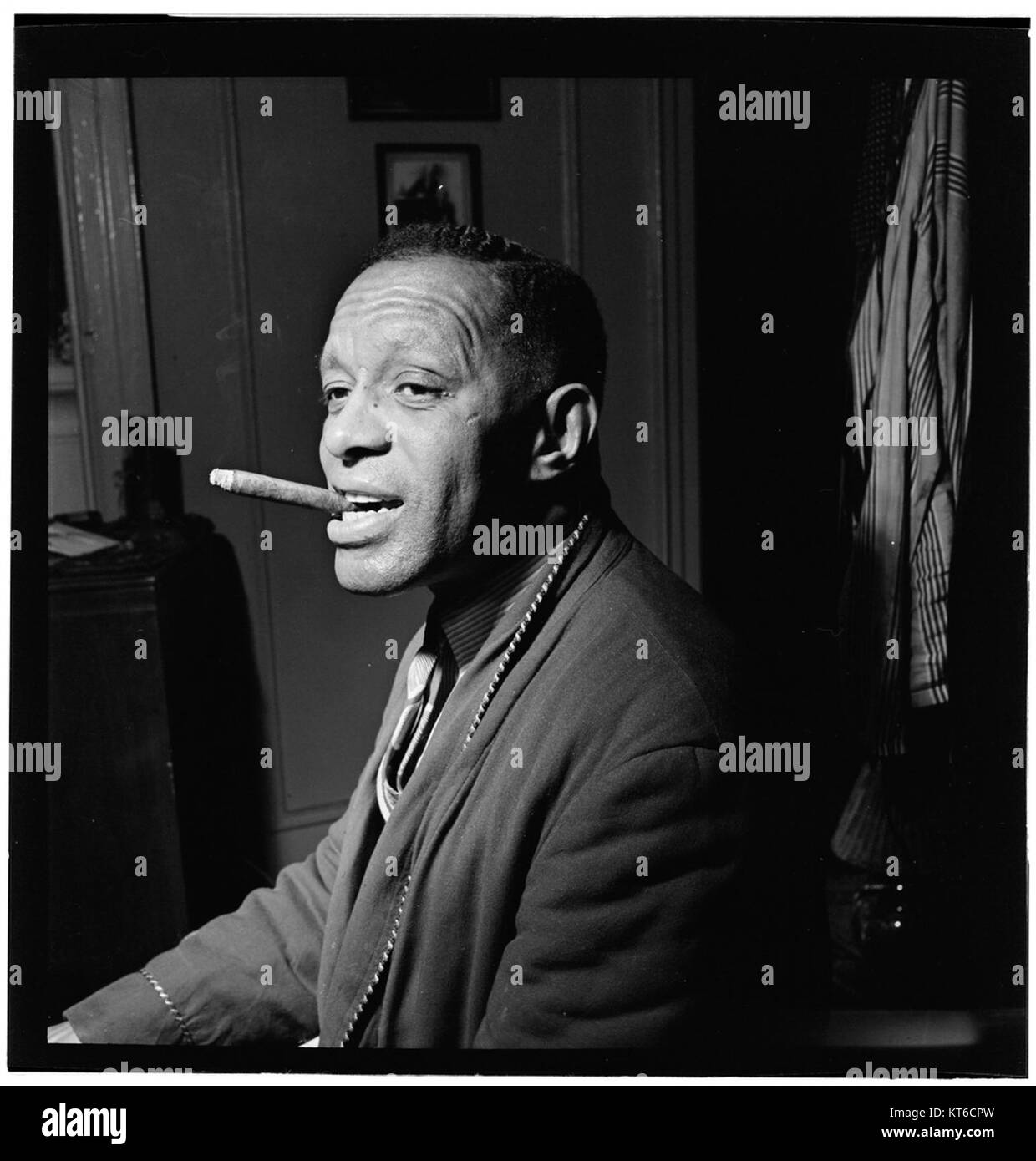 This photograph captures jazz musician Willie Smith in his apartment in ...