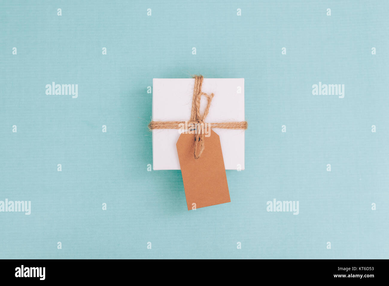 Top view of a small gift box with a label on a blue background Stock ...