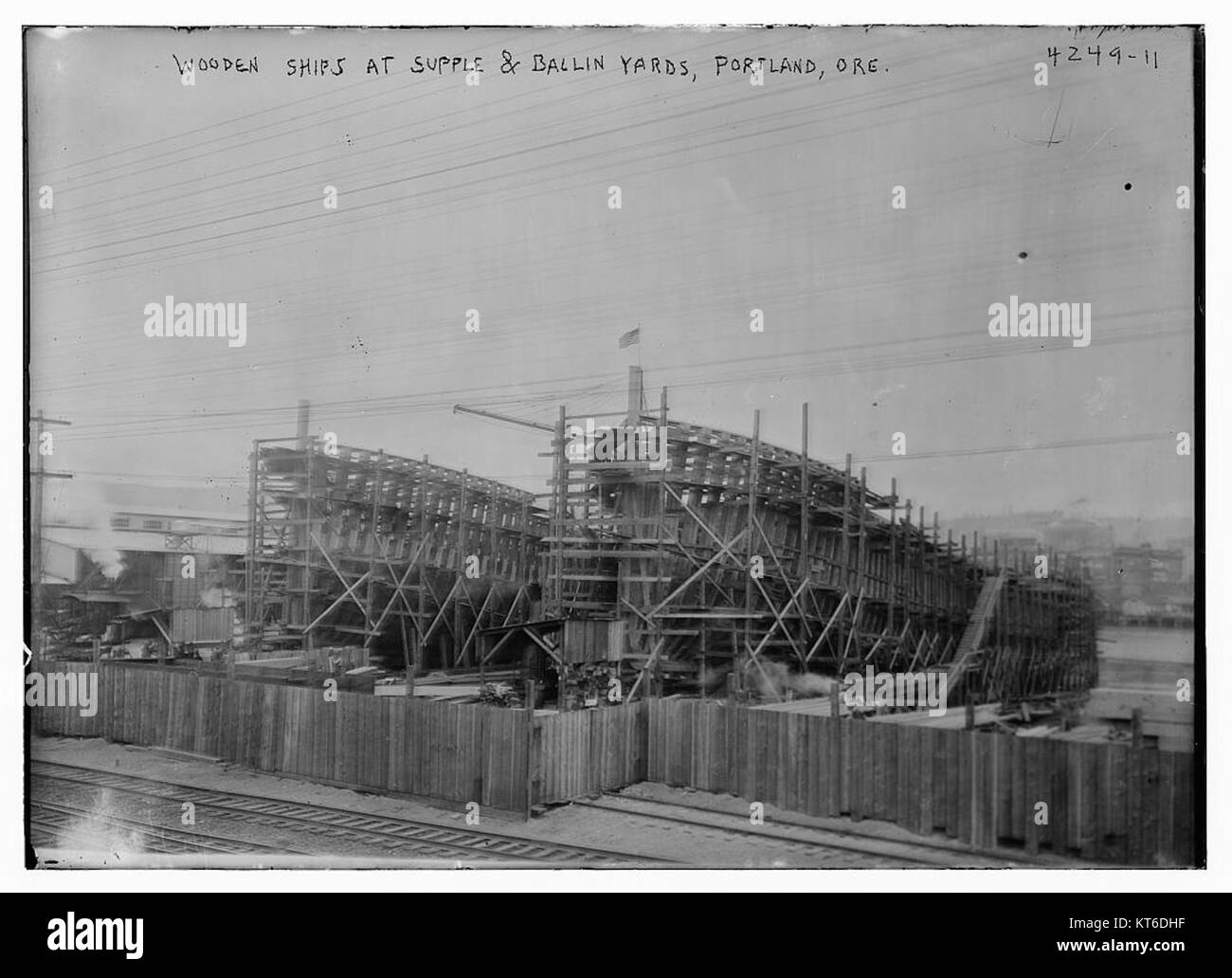 This photograph depicts wooden ships being built at the Supple & Ballin ...