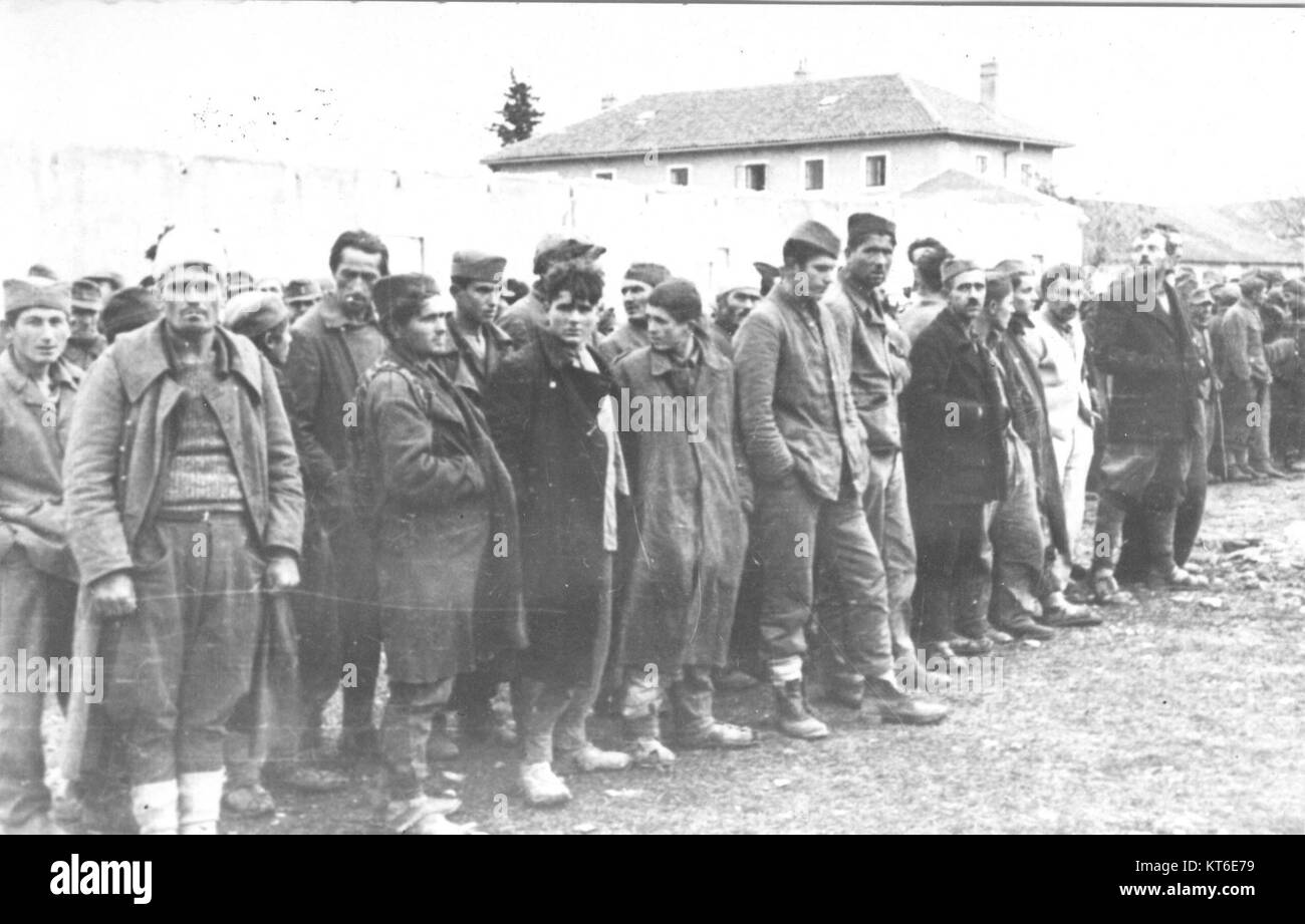 This photograph captures German prisoners of war (POWs) and soldiers ...