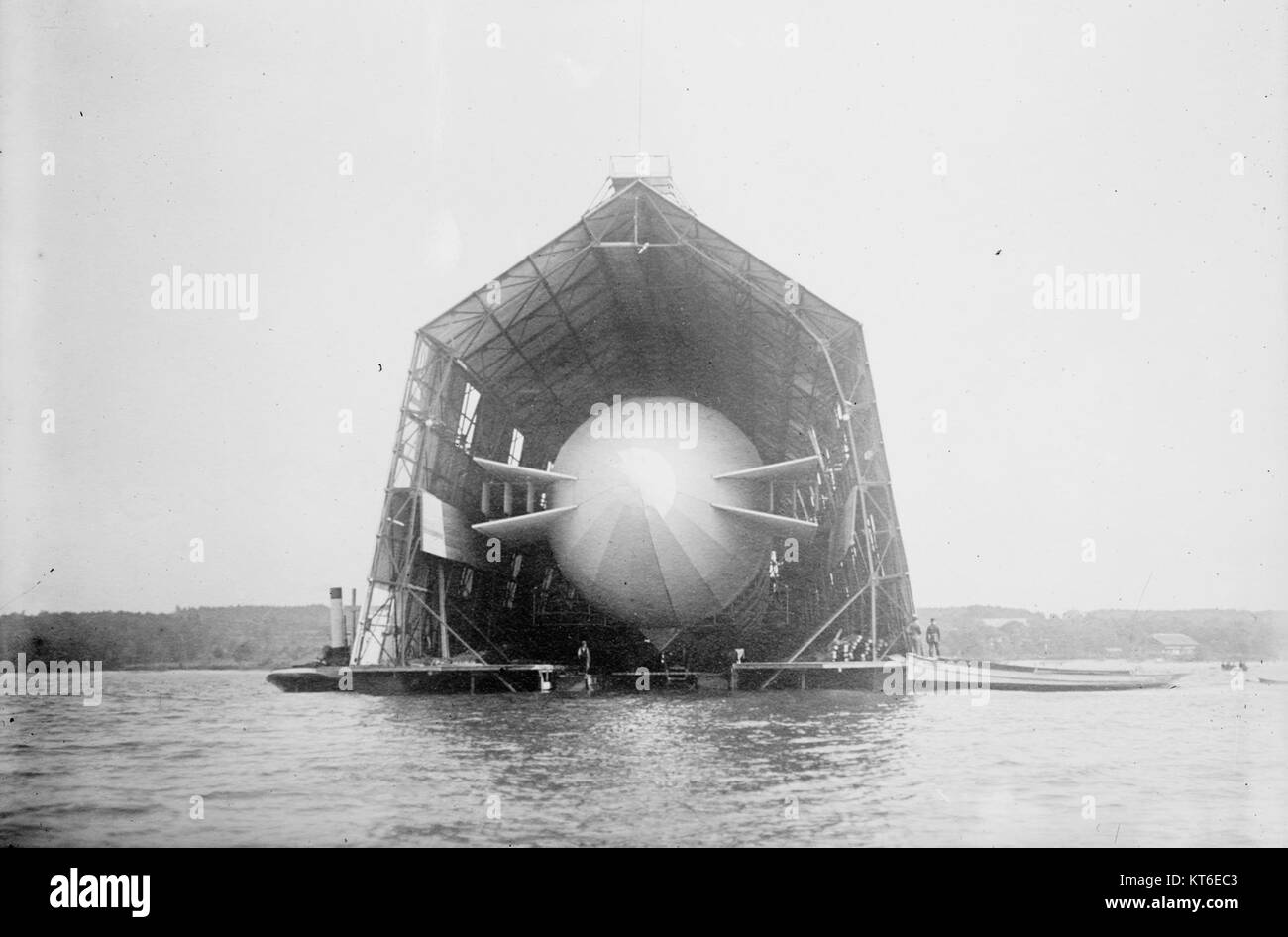 The image shows a Zeppelin inside a floating hangar. The hangar is a ...
