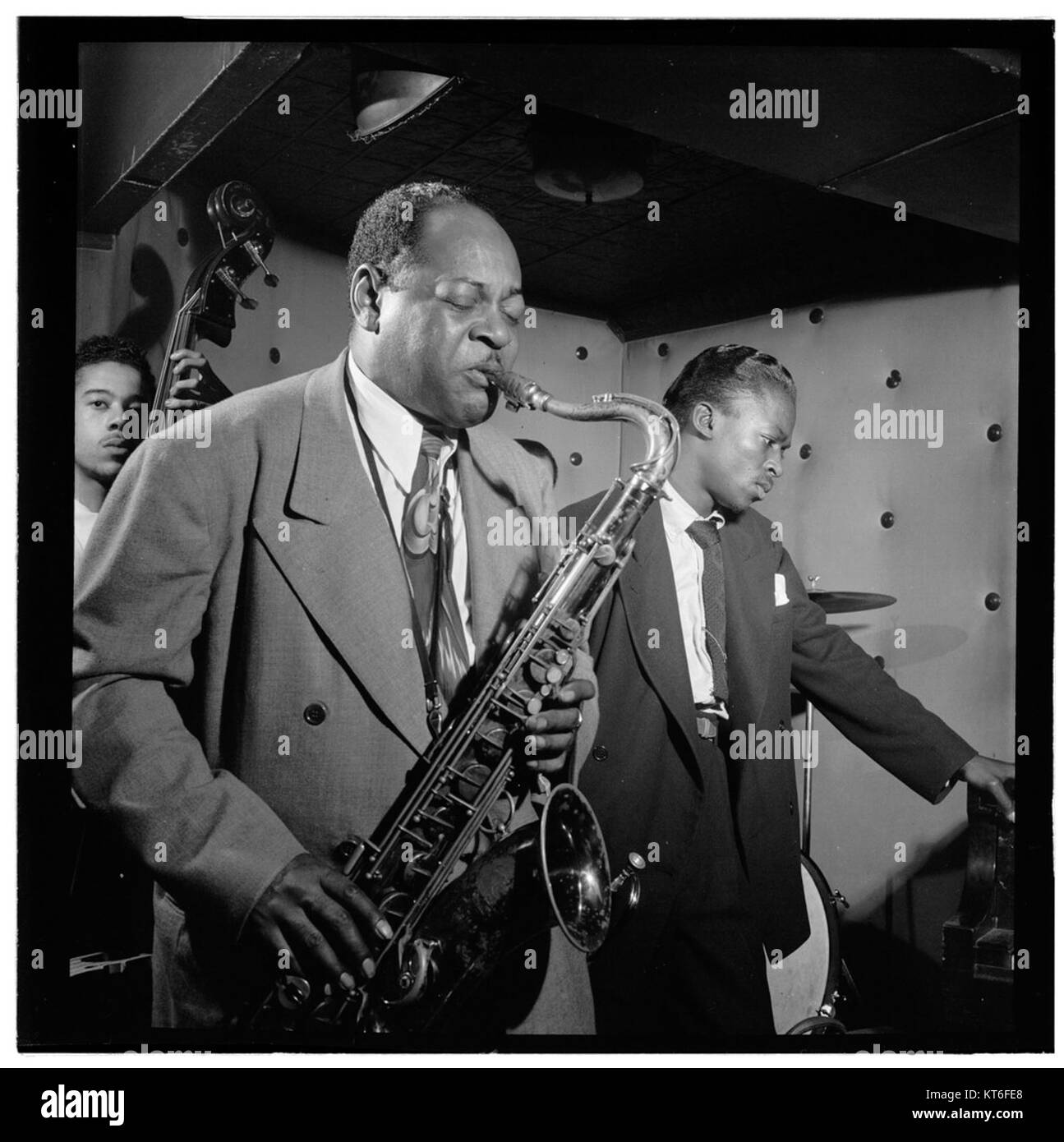 A photograph capturing jazz musicians Coleman Hawkins and Miles Davis ...