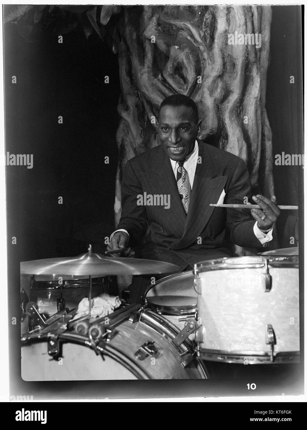 A portrait of Cozy Cole, an influential American jazz drummer, taken ...