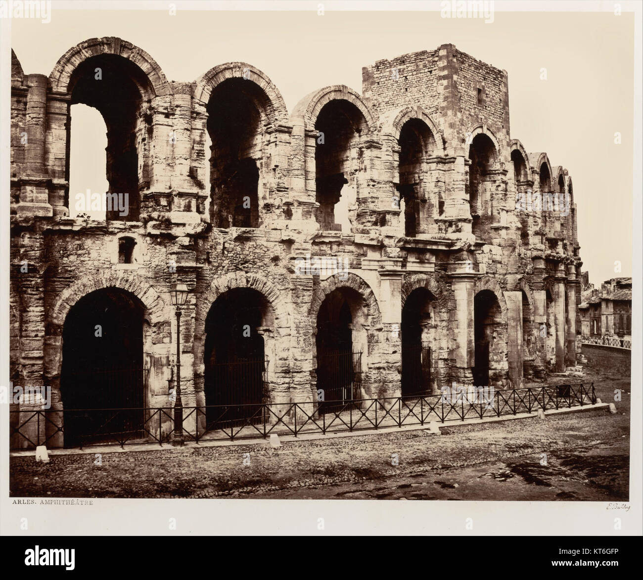 The image depicts the ancient amphitheater in Arles, France, a well ...