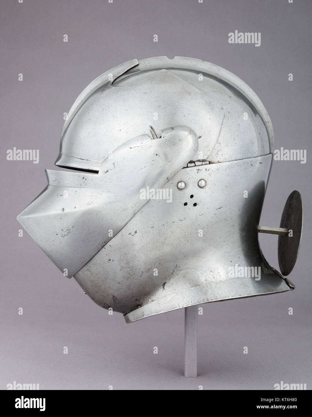 This image shows an armet, a type of medieval armor worn by knights ...