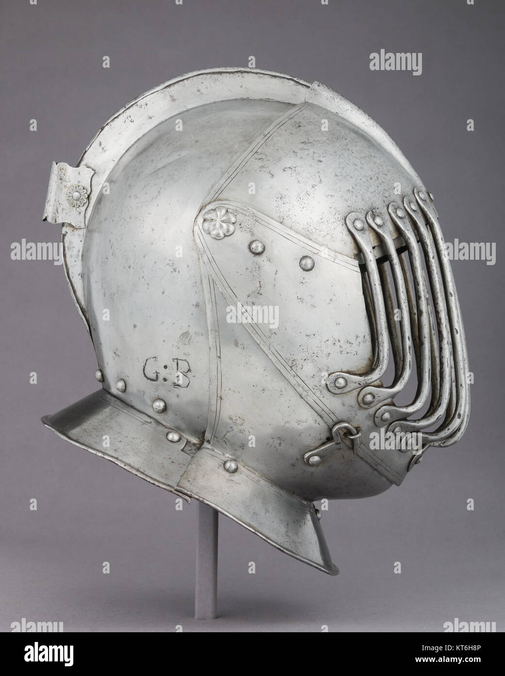This image shows an armet, a type of medieval helmet, displayed at the ...