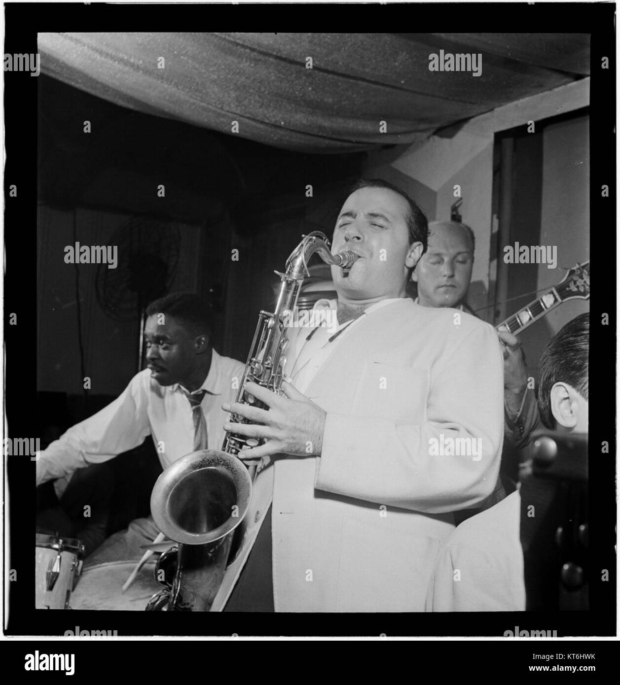 A 1947 photograph capturing jazz musicians Flip Phillips, Denzil Best ...