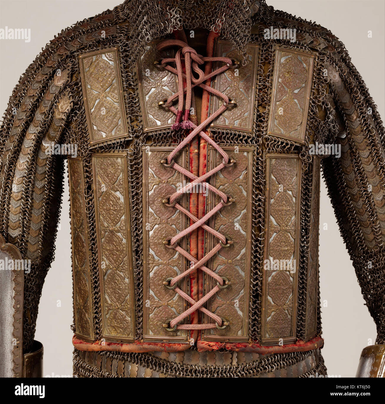 This historical armor, made of mail and plate, is part of the ...