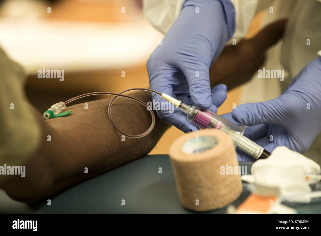 Spc. Tracy Ortiz, 7417th Troop Medical Clinic, draws blood during ...