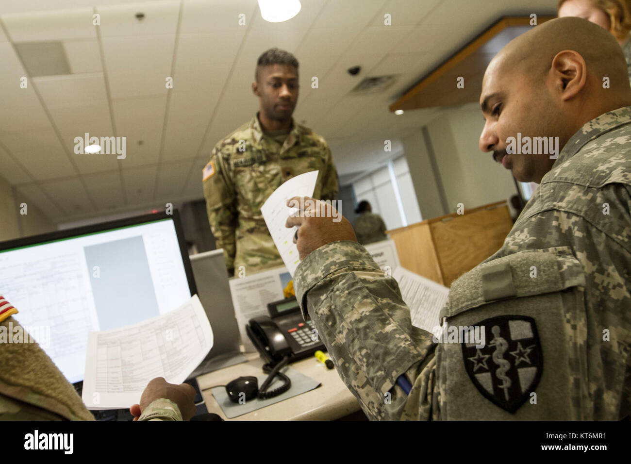 Sgt. Jeffery Rayman, 7250th Medical Support Unit, provides guidance ...