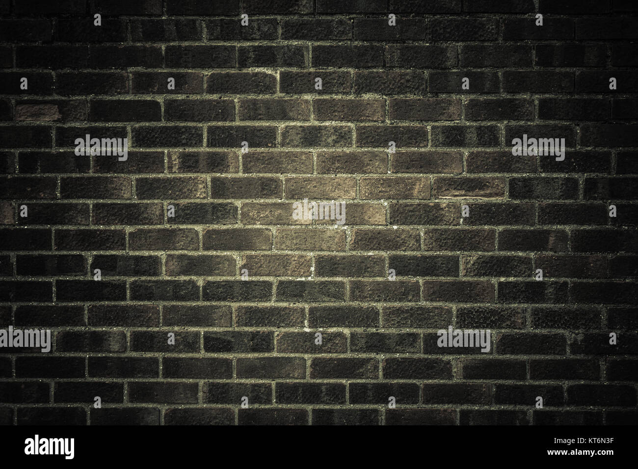 Architecture. Closeup of dark gray brick wall as texture or background ...