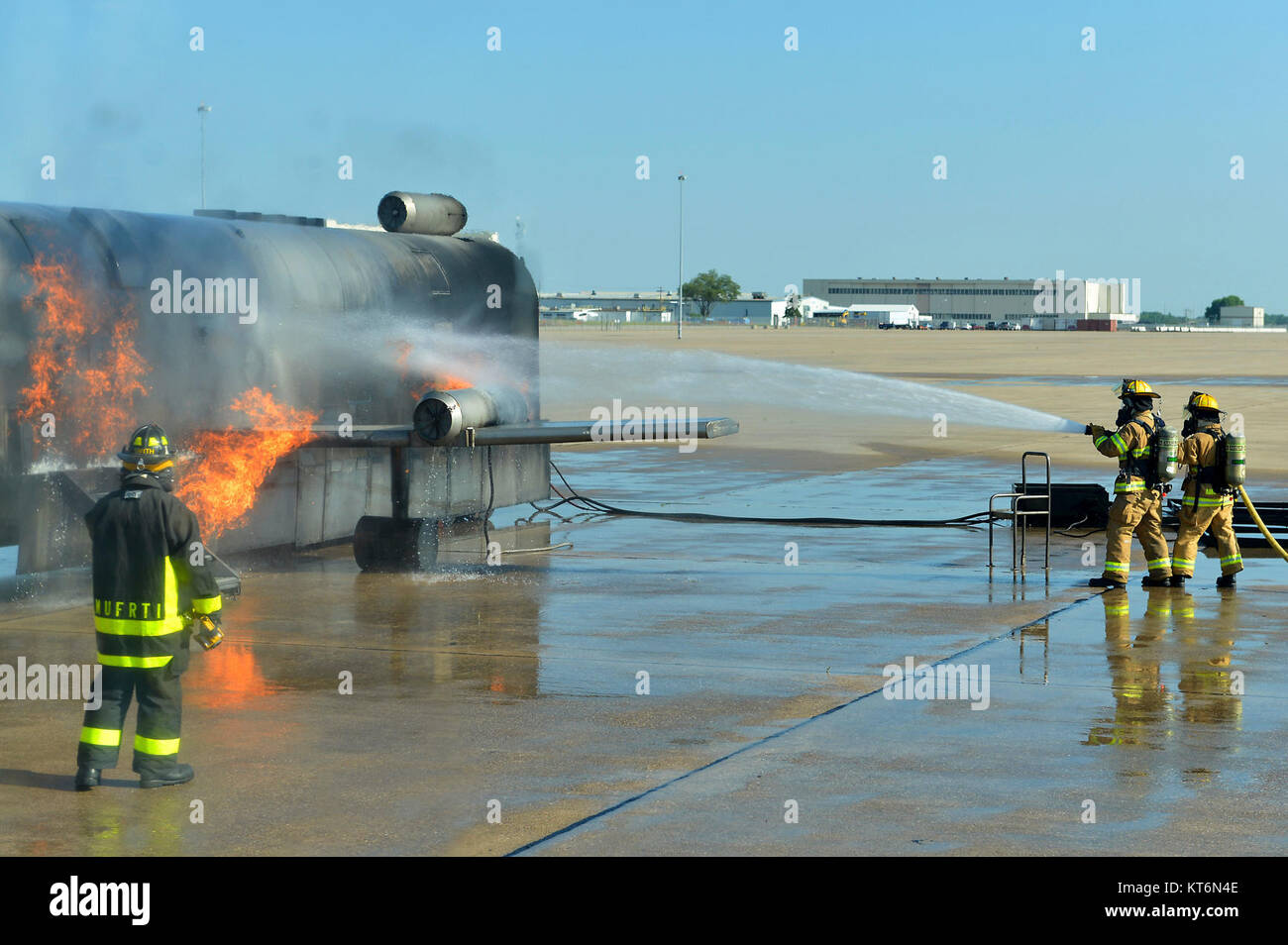 Members of the 155th Civil Engineering Fire Department practice their ...