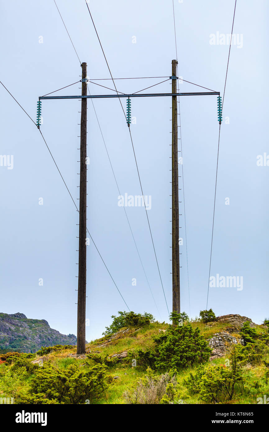 Big voltage poles, electricity pylon, transmission power tower in green ...