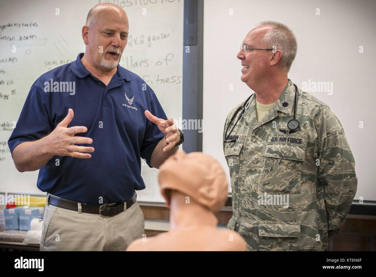 Lt. Col. Dan Naumann, 512th Airlift Wing physician, speaks with John ...