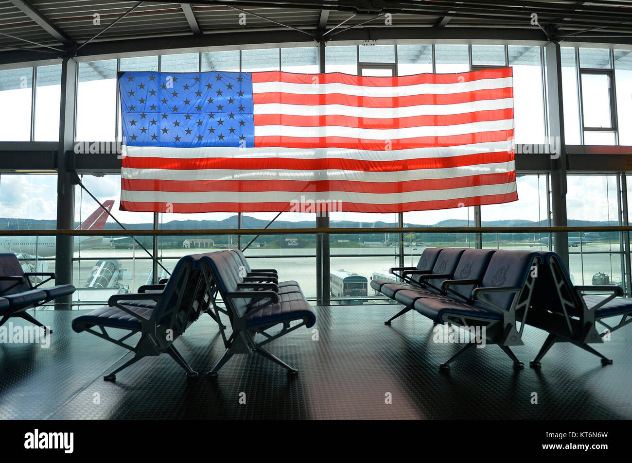 A U.S. flag hangs over the passenger terminal on Ramstein Air Base ...