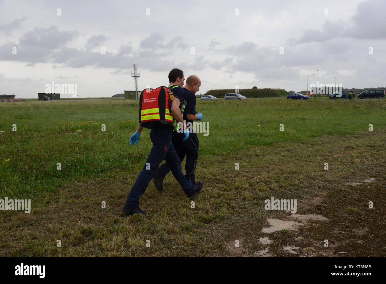 Two members of Belgian Emergency Medical Services arrive to provide ...
