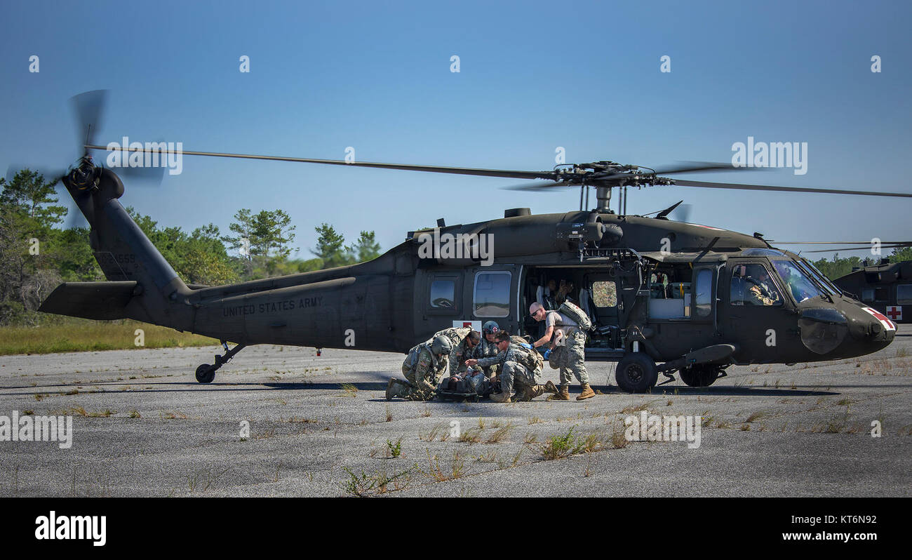 U.S. Army 6th Ranger Training Battalion members, load a simulated ...