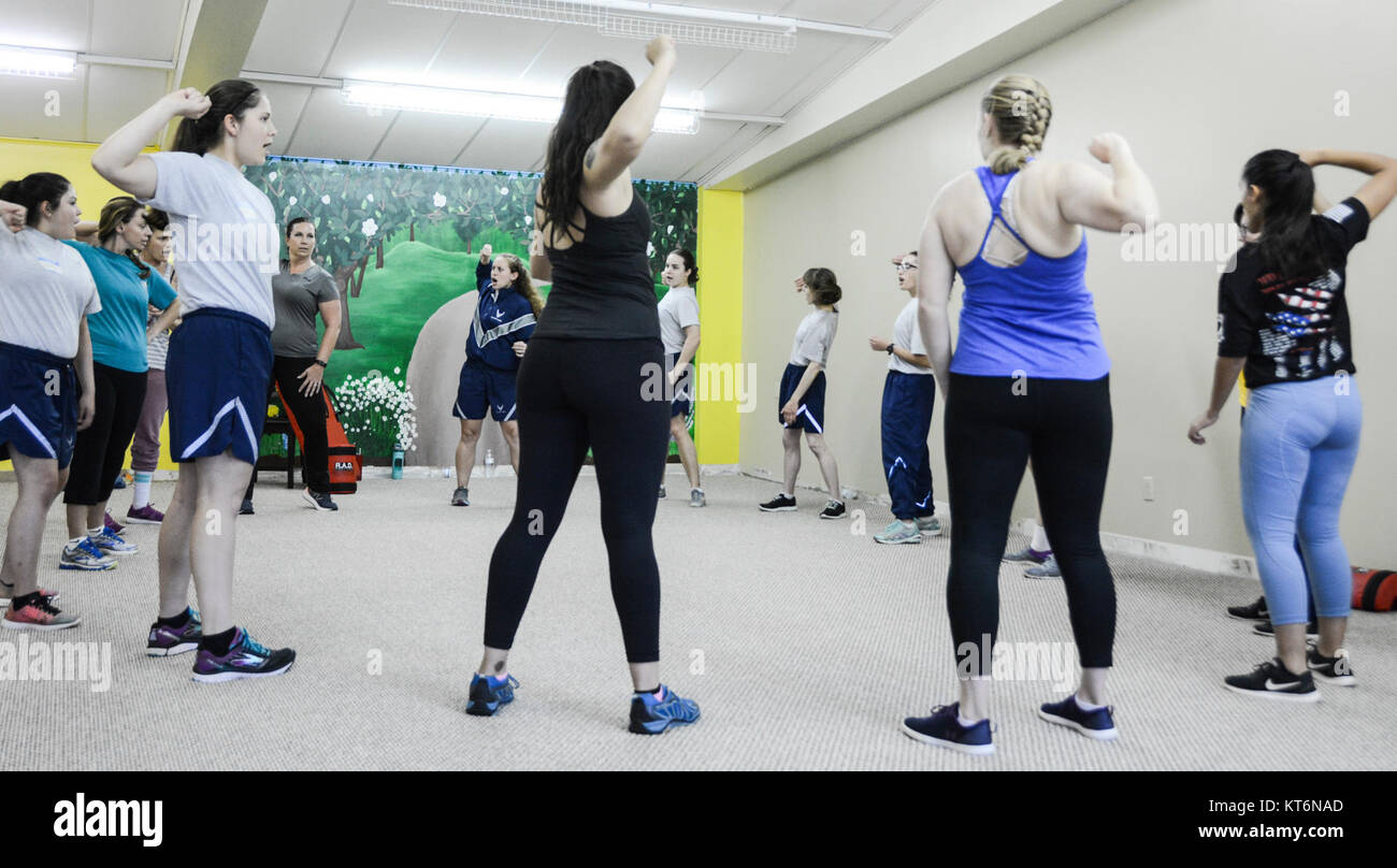 Students of the Rape Aggression Defense class practice exercises to ...