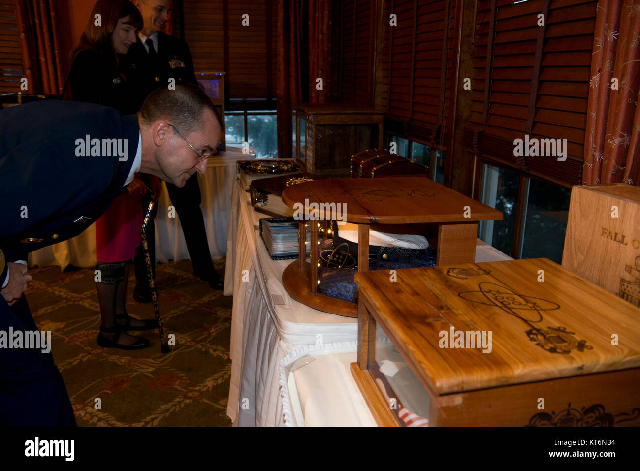 Coast Guard Vice Commandant Adm. Charles Michel looks at the hat boxes ...