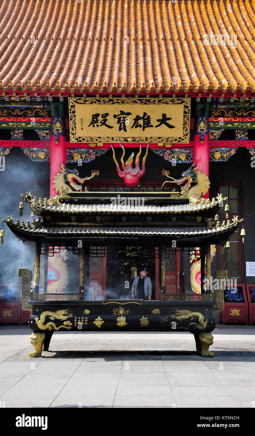 May 5, 2016. harbin, china. A chinese man walking out of the entrance ...