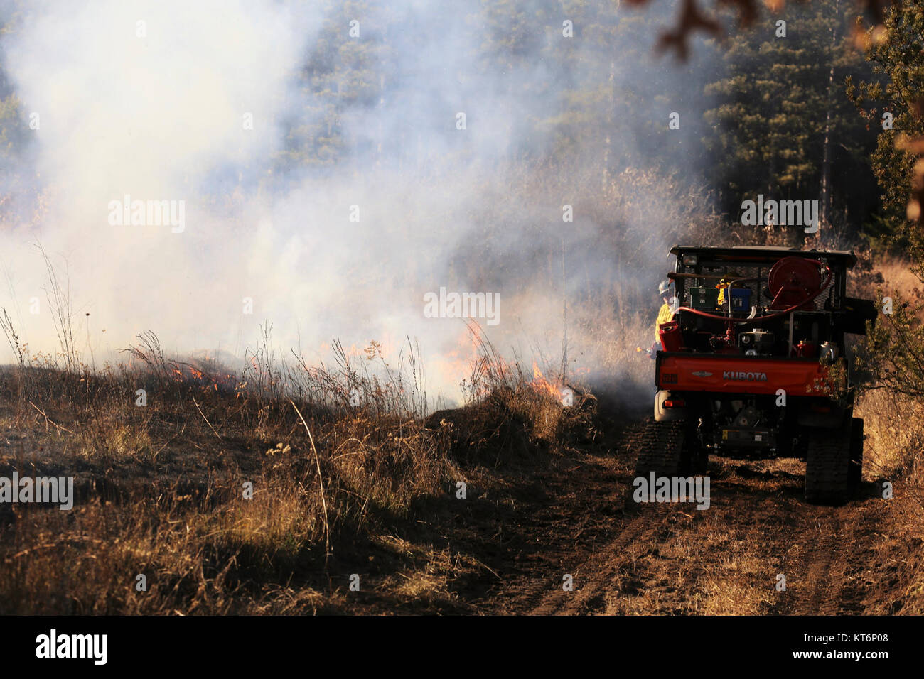 Post personnel oversee a prescribed burn Nov. 30, 2017, at Range 100 on ...