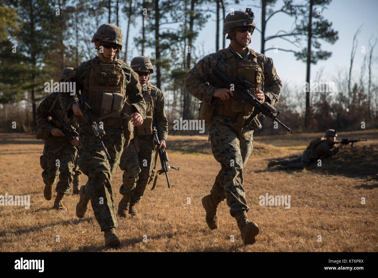 U.S. Marines with Echo Co., 2nd Battalion, 8th Marine Regiment run from a practice to a live ...