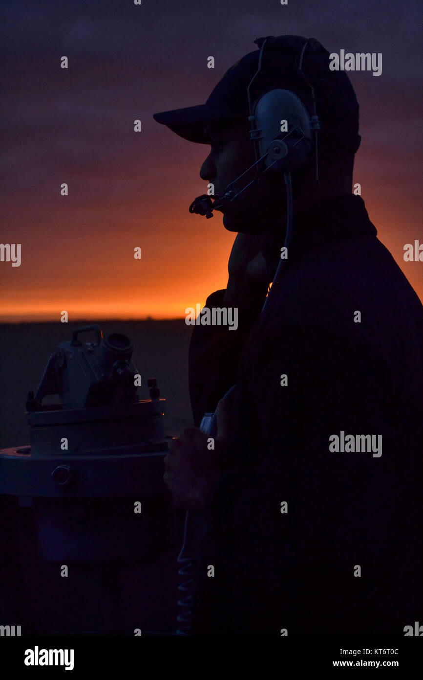A Sailor stands a lookout watch aboard USS Cole (DDG 67). Cole is ...