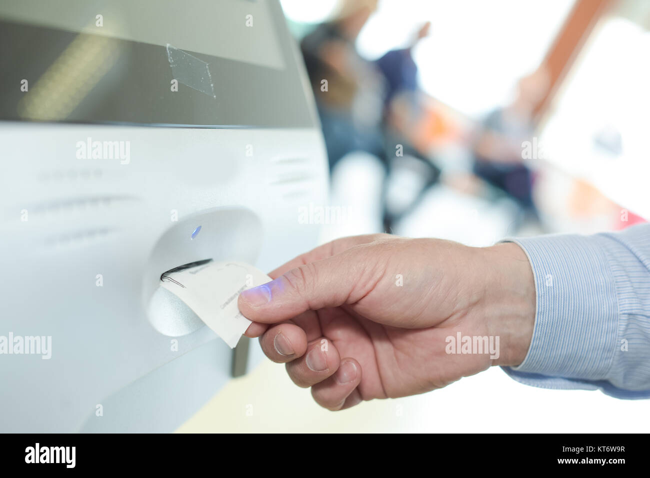 man taking a ticket Stock Photo - Alamy