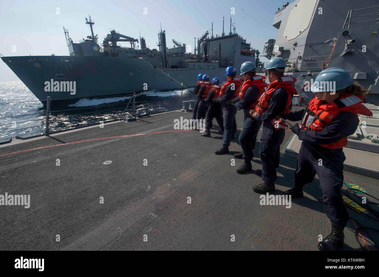 Servicemen at work aboard US navy aircraft carrier Stock Photo - Alamy