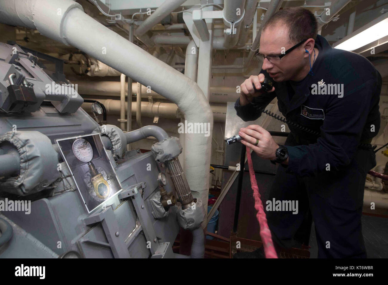 Servicemen at work aboard US navy aircraft carrier Stock Photo - Alamy
