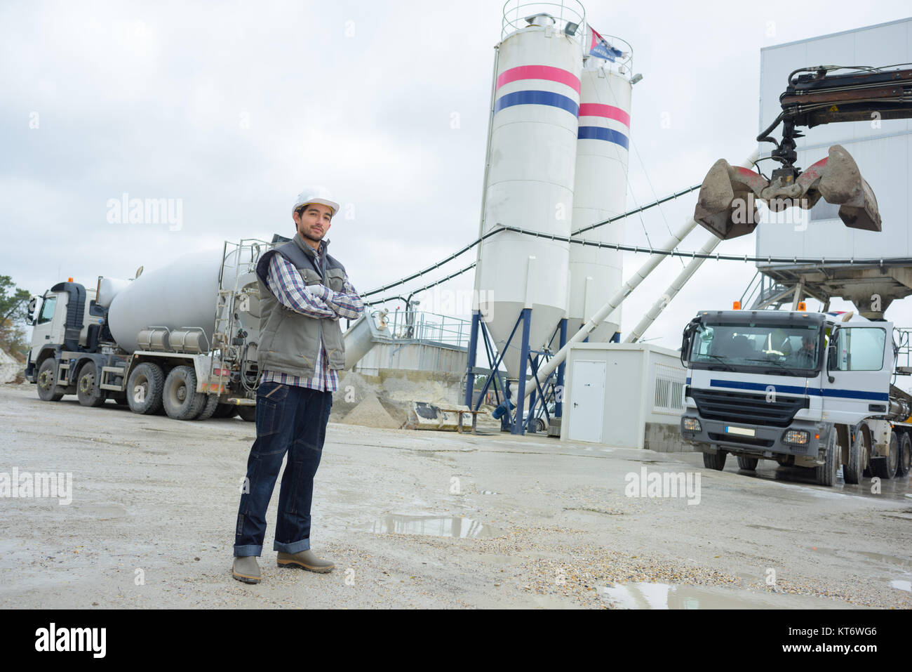 man engineer with blueprint and oil tanks Stock Photo - Alamy