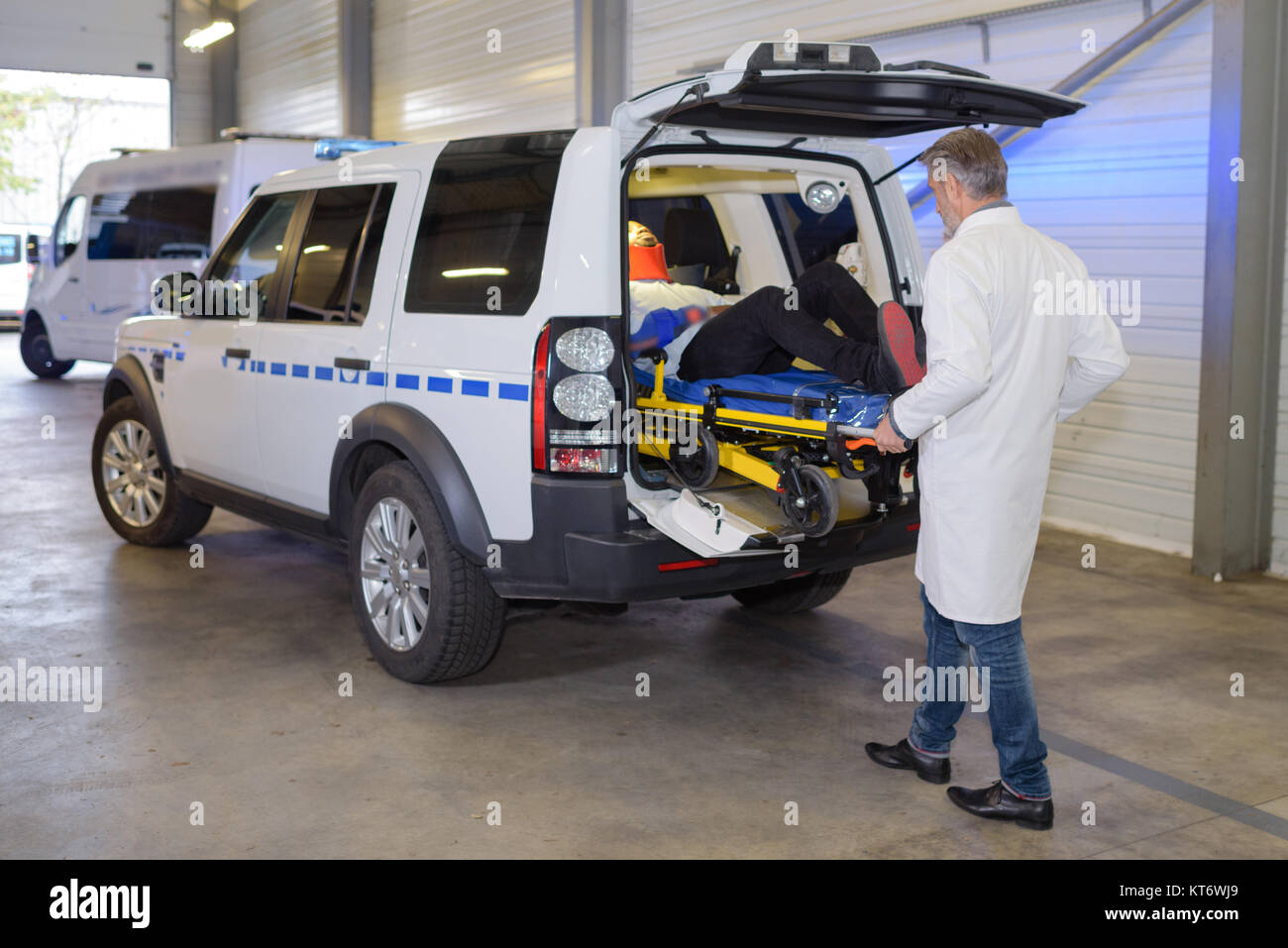 paramedics transporting a victim Stock Photo - Alamy