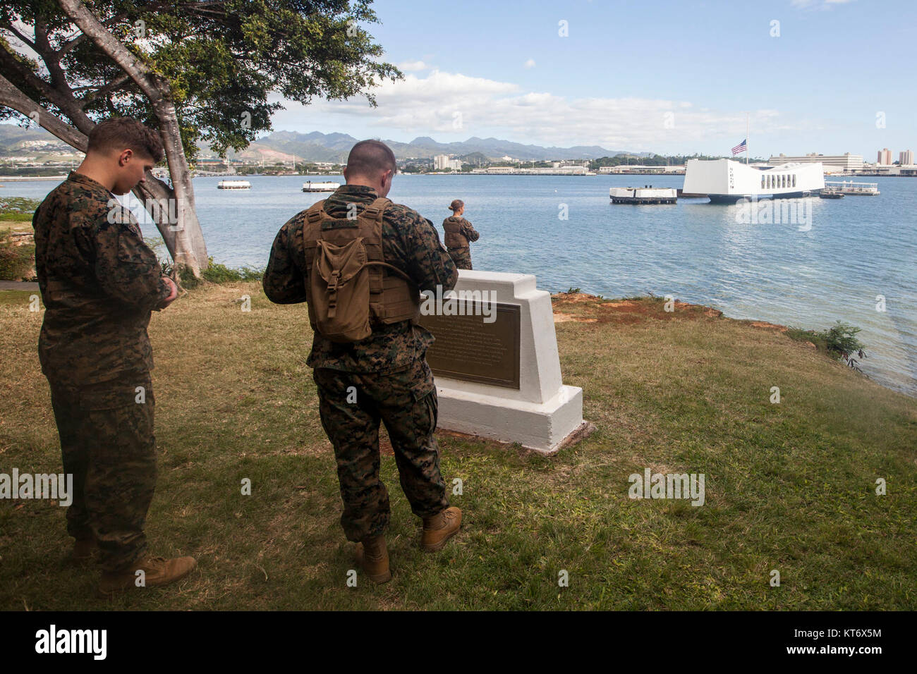 U.S. Marines with 3rd Radio Battalion view a plaque dedicated to the ...