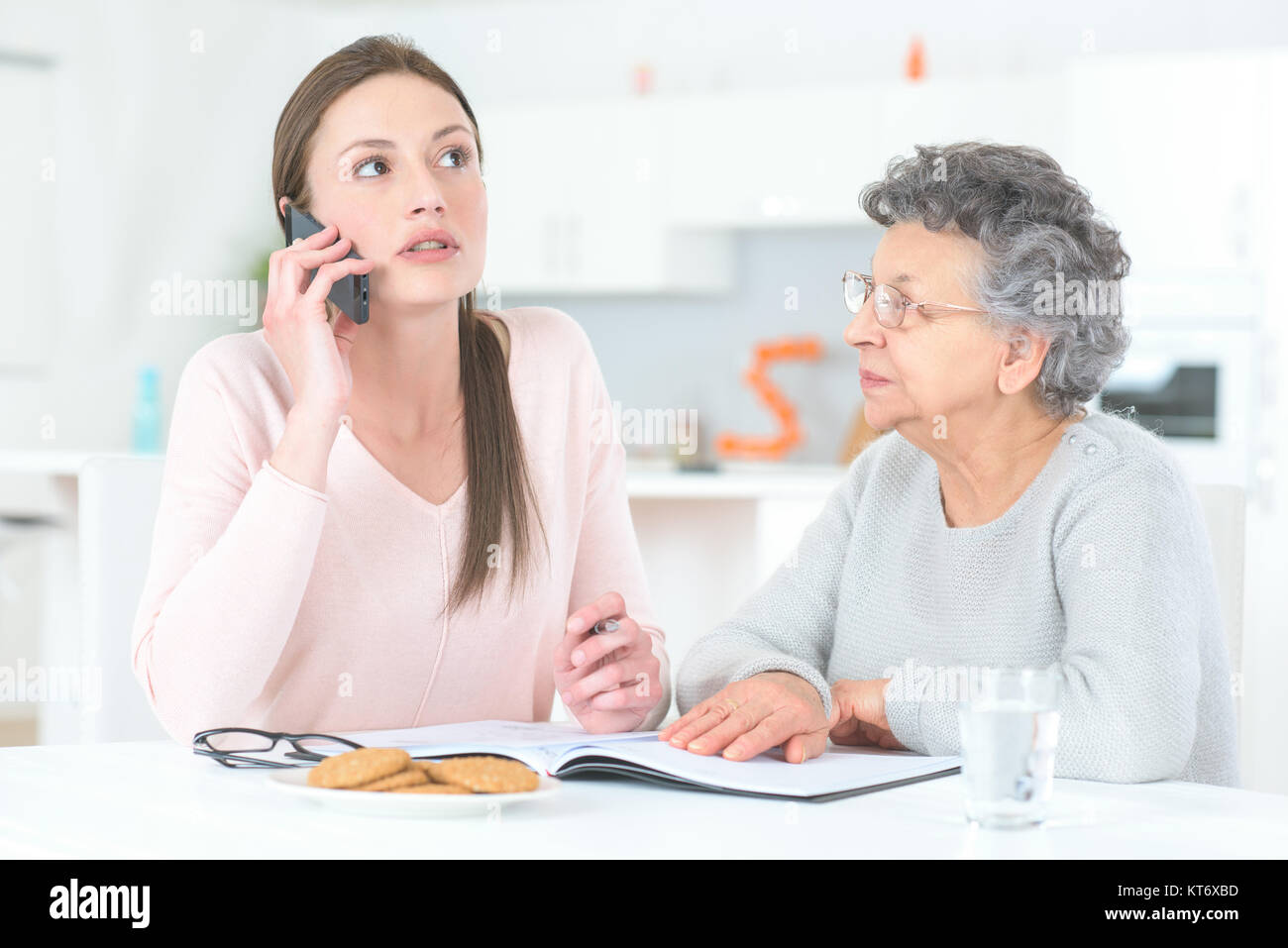 daughter and elderly mother making a phone call Stock Photo - Alamy