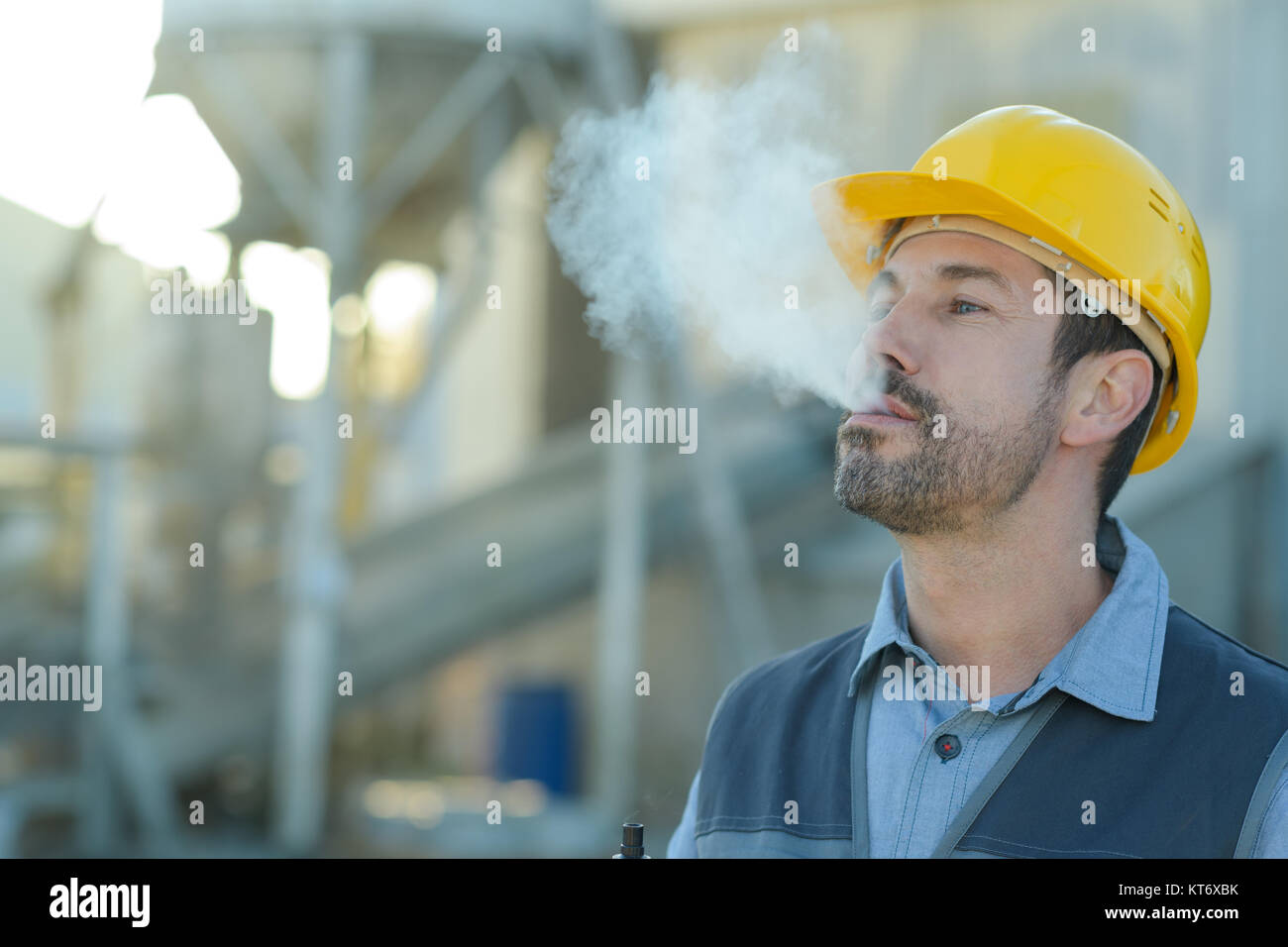 builder worker with a cigarette smoke break Stock Photo - Alamy