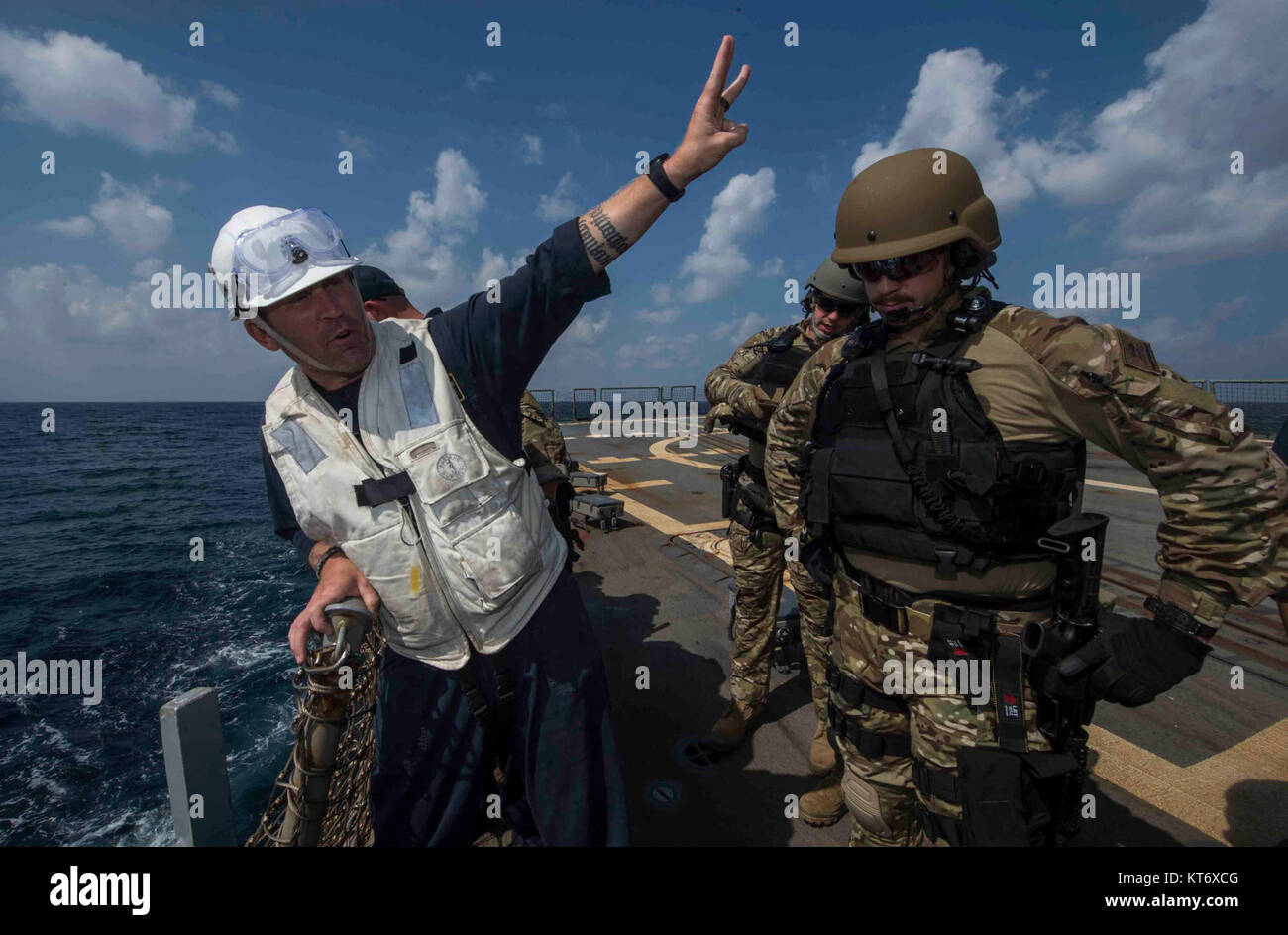 Servicemen at work aboard US navy aircraft carrier Stock Photo - Alamy