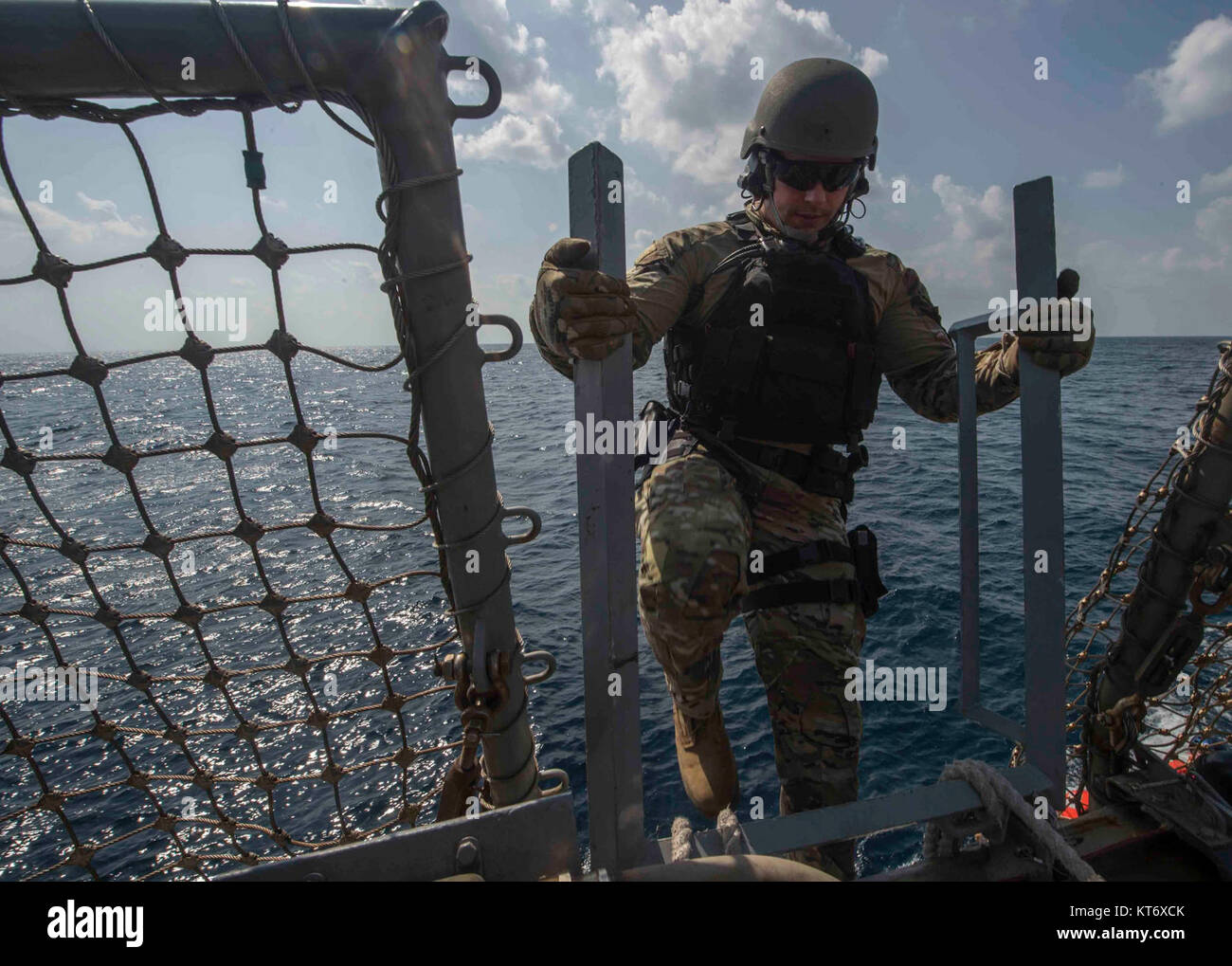 Servicemen at work aboard US navy aircraft carrier Stock Photo - Alamy