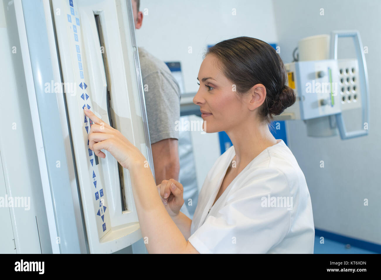 a female doctor checking hospital board Stock Photo - Alamy