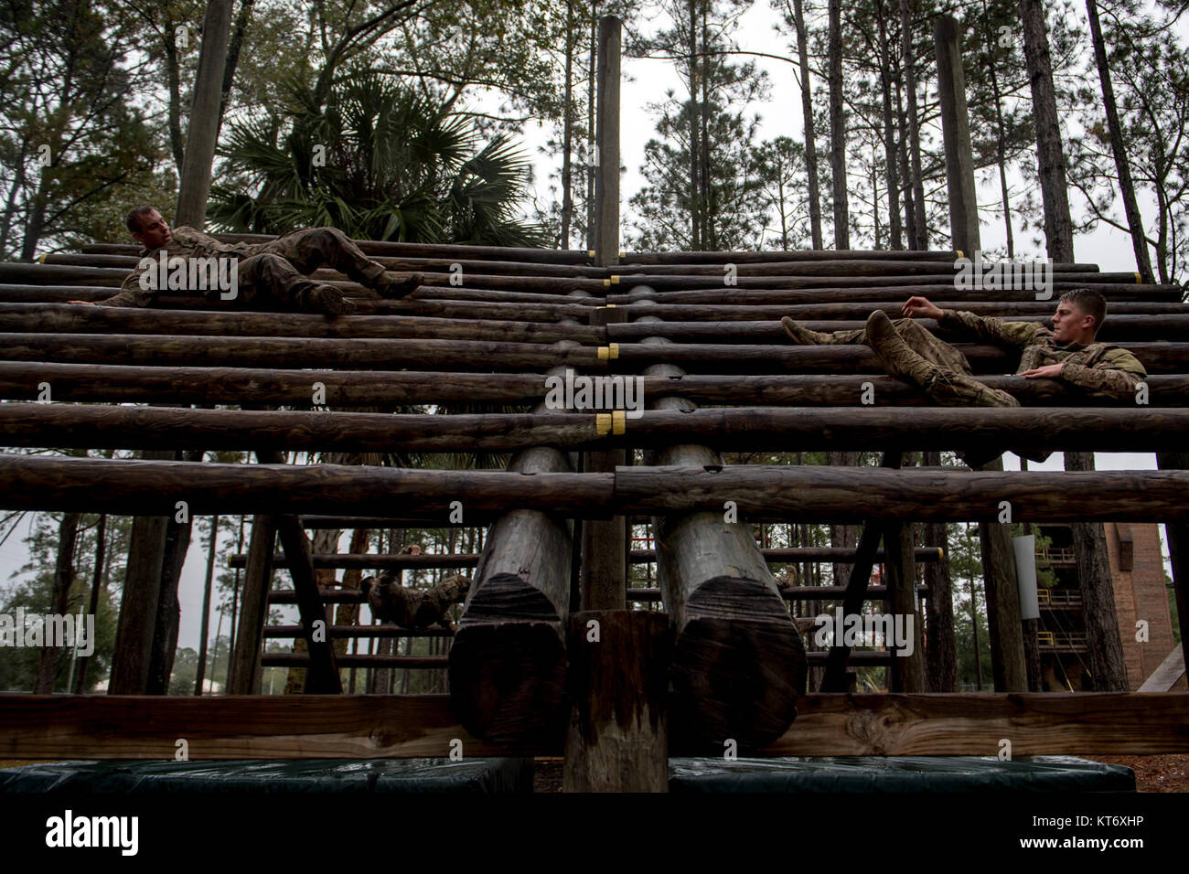 Airmen from the 820th Base Defense Group navigate the weaver obstacle ...