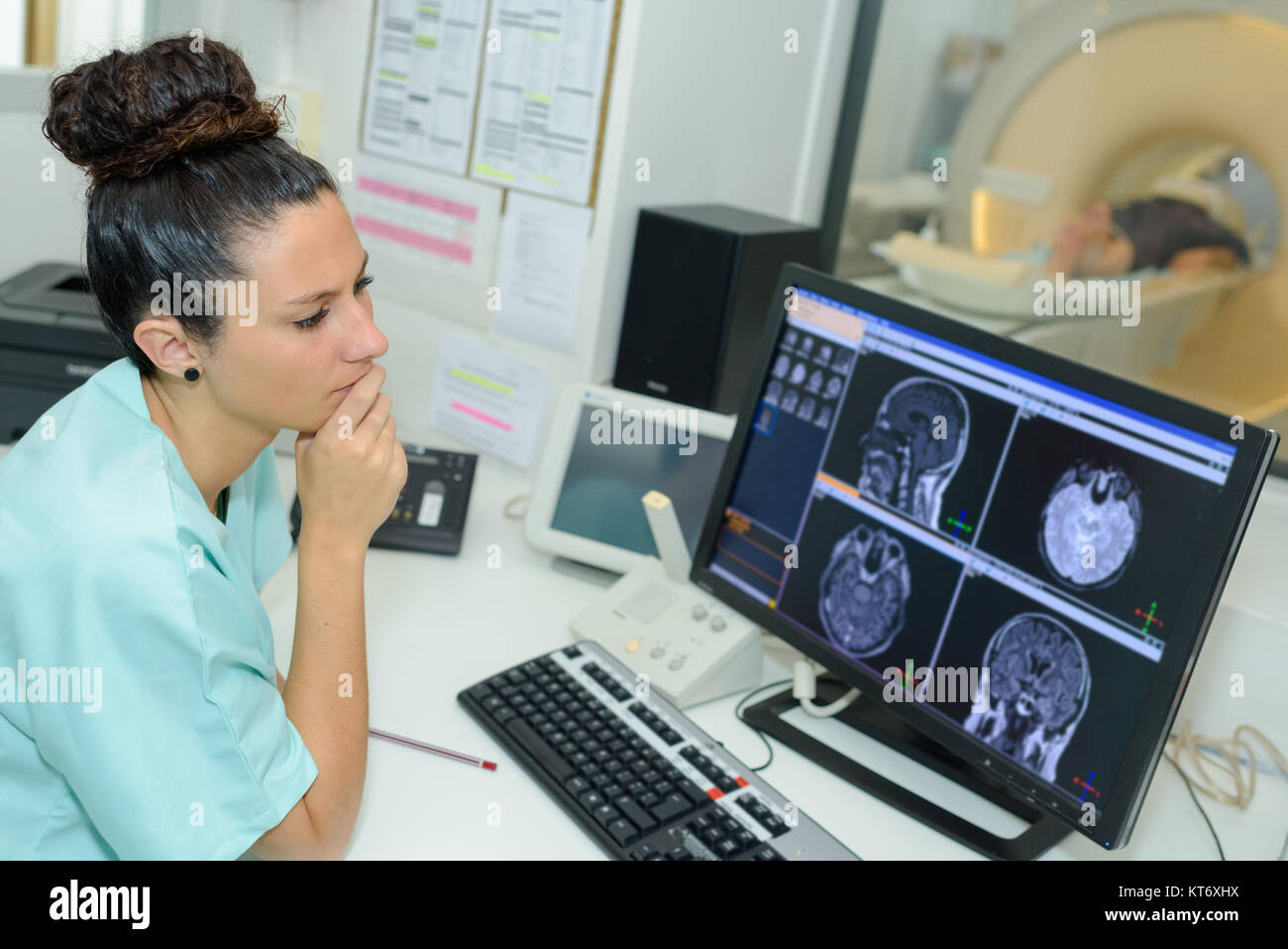 female doctor looking at patient undergoing ct scan Stock Photo - Alamy