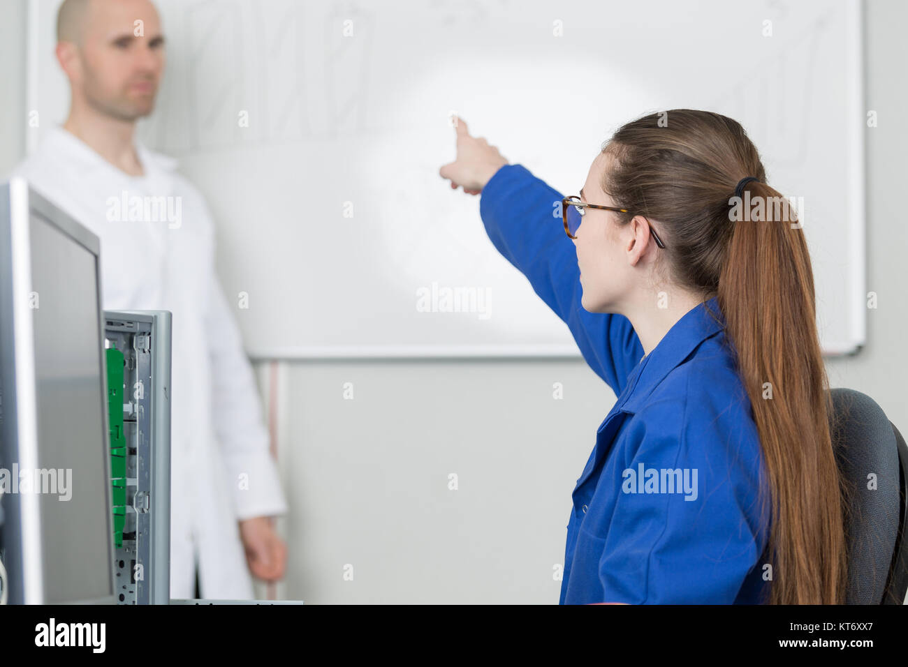 young female student pointing at blackboard Stock Photo - Alamy