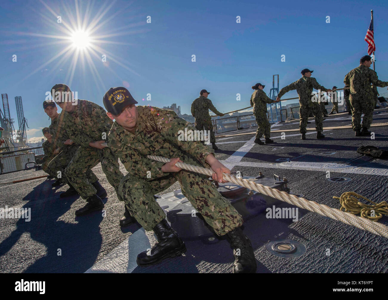 - Sailors perform line-handling duties aboard the Arleigh Burke-class ...