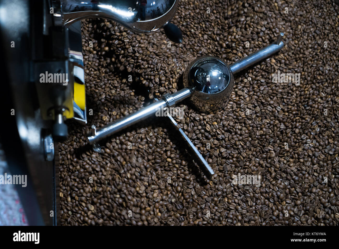 Mixing roasted coffee Stock Photo - Alamy