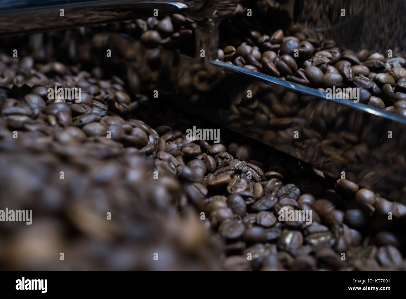 Mixing roasted coffee Stock Photo - Alamy