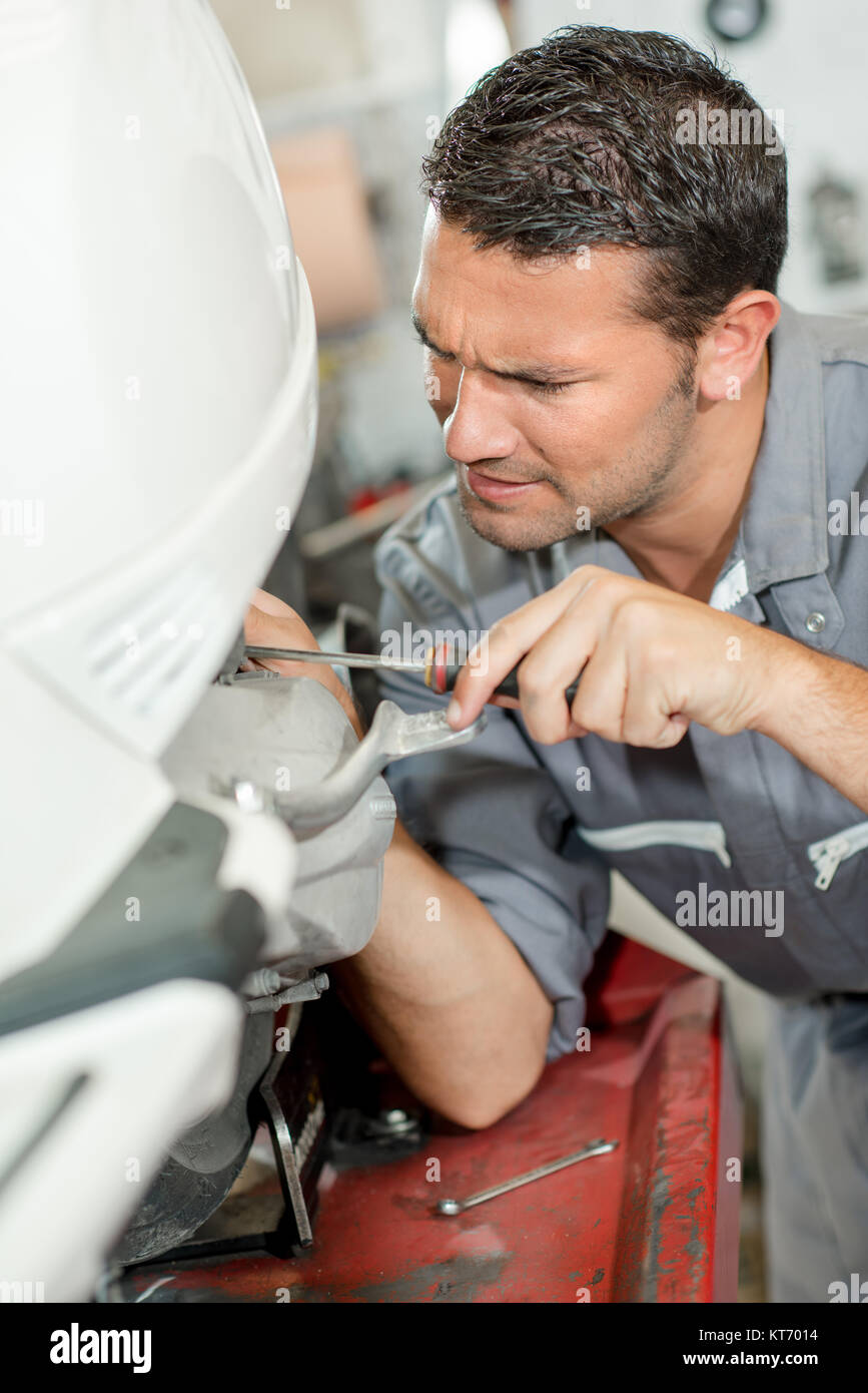 Mechanic repairing scooter hi-res stock photography and images - Alamy