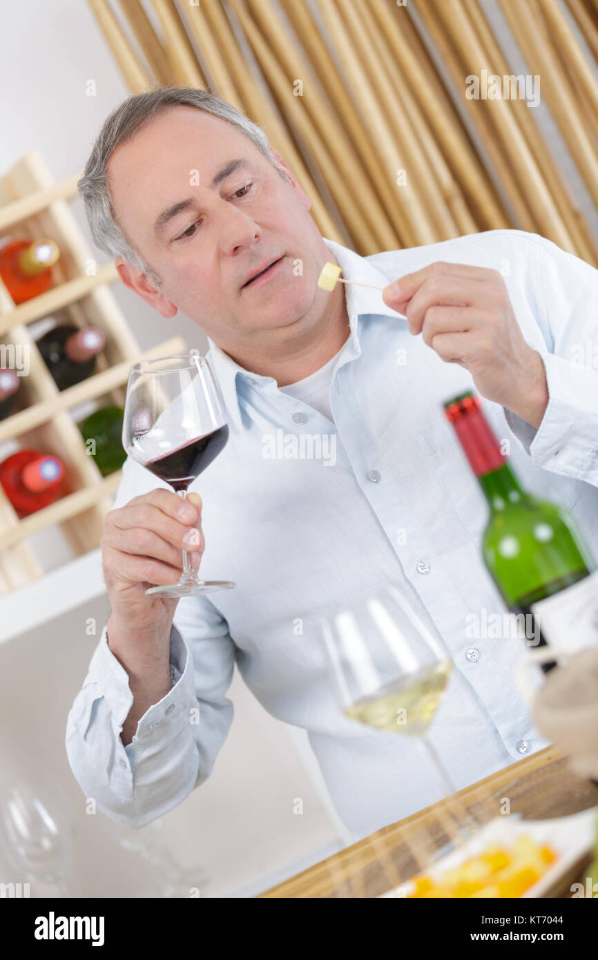 oenophile testing the wine with cheese Stock Photo - Alamy