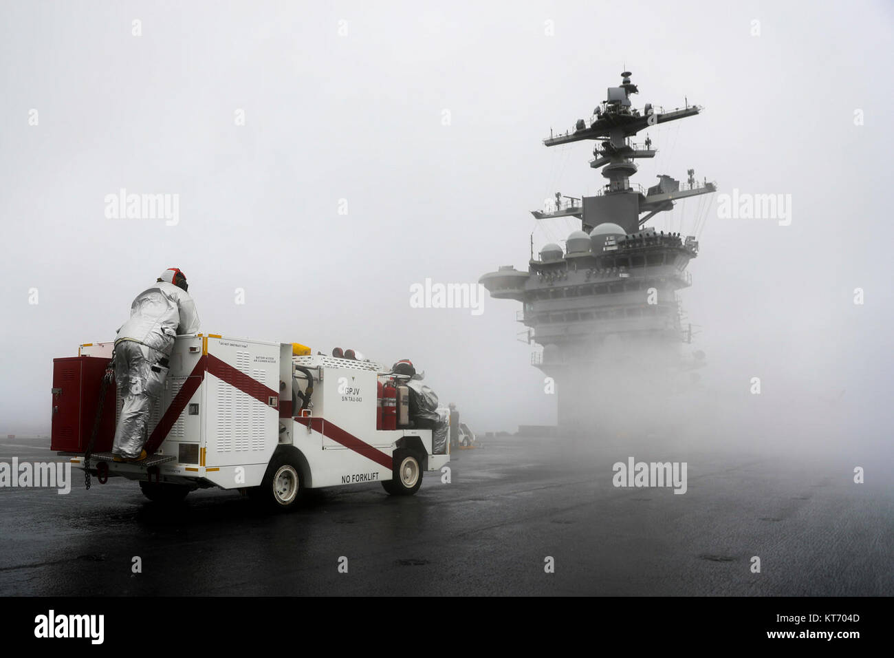 U.S. Sailors assigned to crash and salvage aboard the Nimitz-class ...