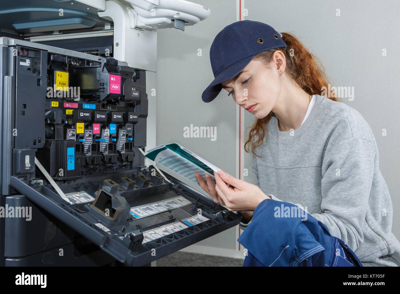 reading the printer manual and description guide Stock Photo - Alamy