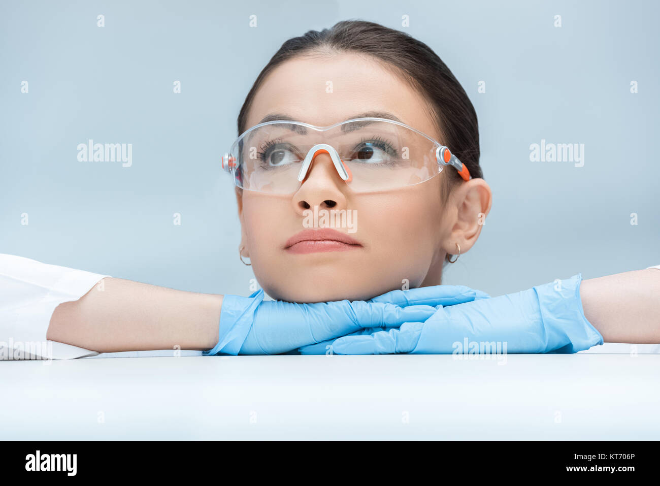 portrait of pensive scientist looking away in lab Stock Photo - Alamy