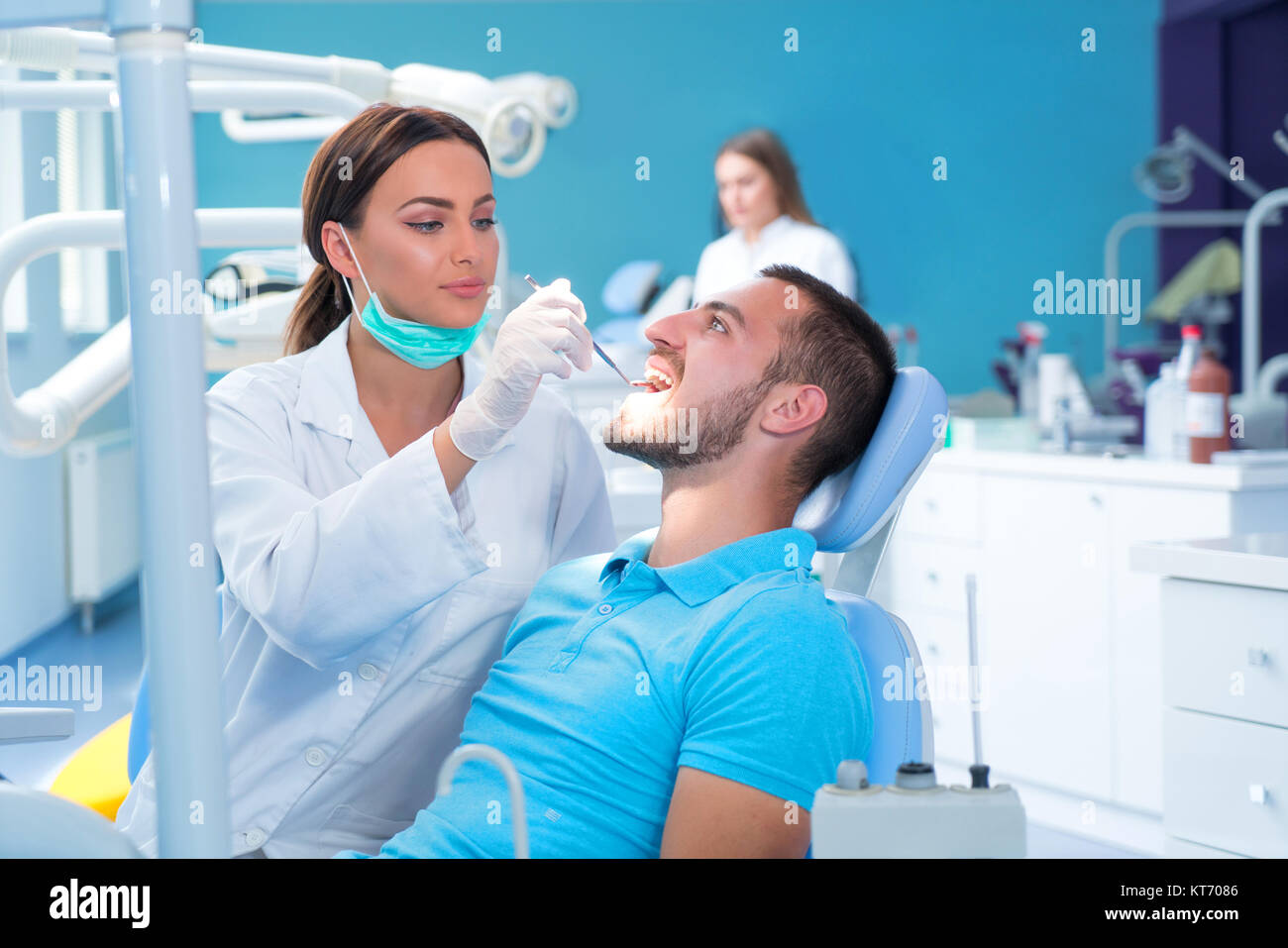 Doctor talking with her patient. Dentist concept Stock Photo - Alamy